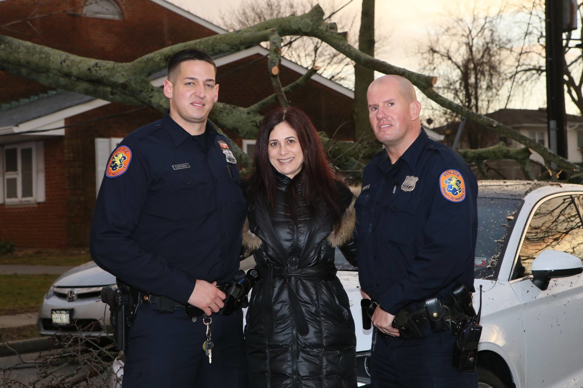 Police rescue woman trapped in car by branches, wires | Herald ...